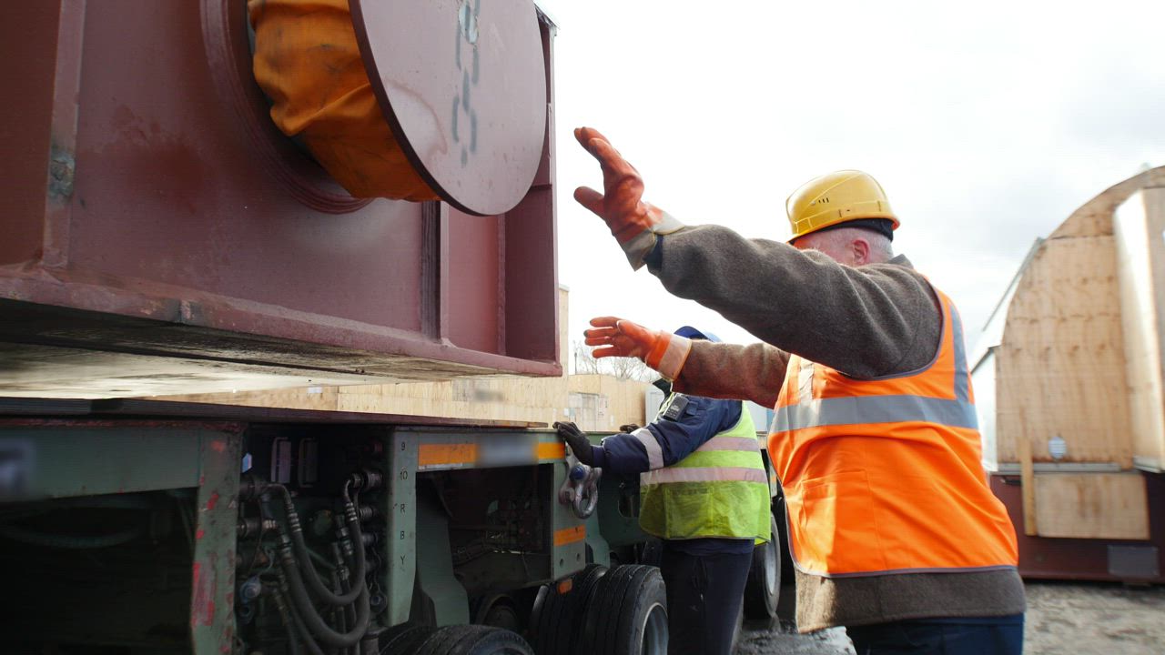 Men working loading a freight truck - Free Stock Video