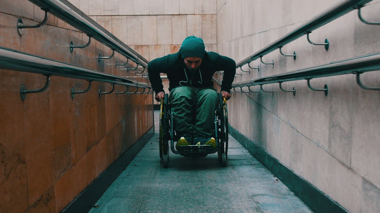 Disabled man going up a ramp - Free Stock Video