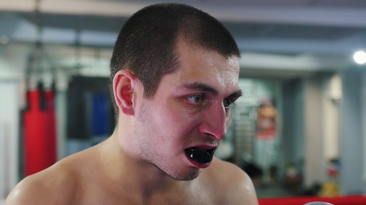 Boxer receives a hit in the face - Free Stock Video