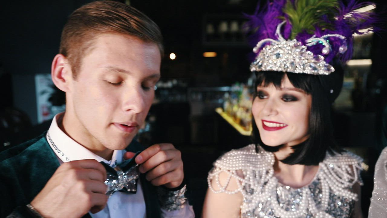 People wearing retro theme party costumes at a bar - Free Stock Video