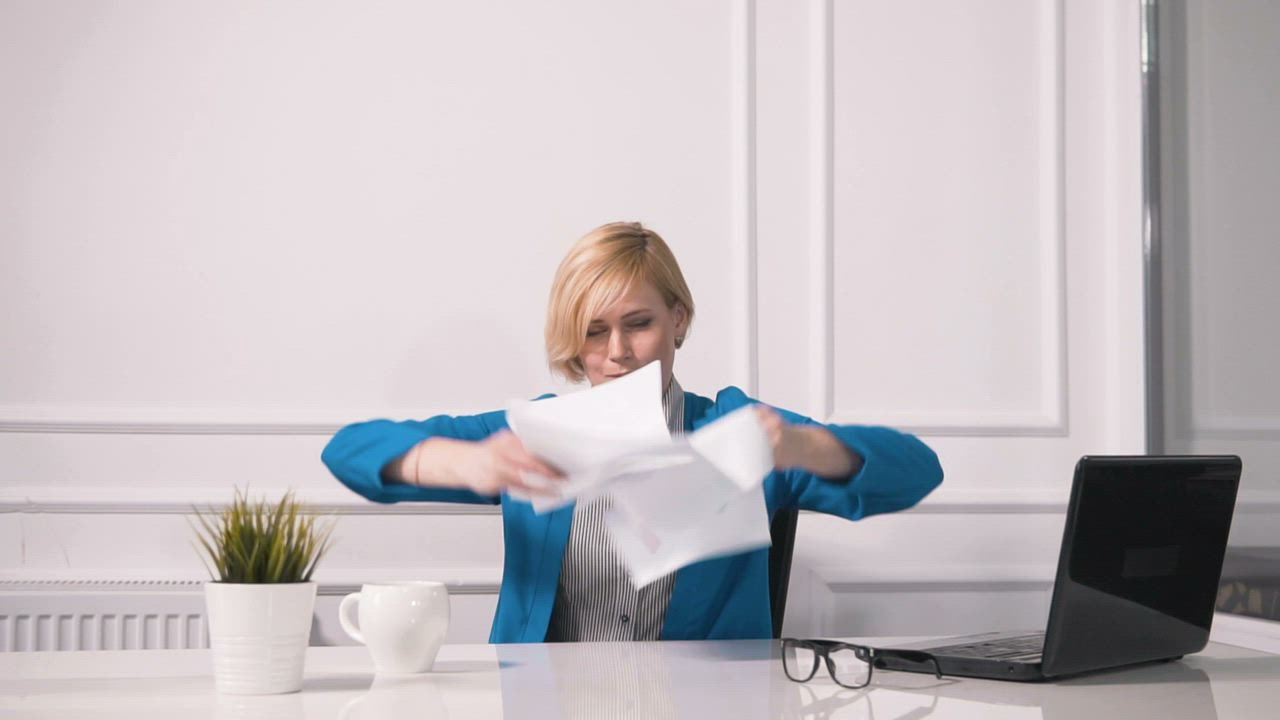 Tired woman fed up with work throws papers in air - Free Stock Video