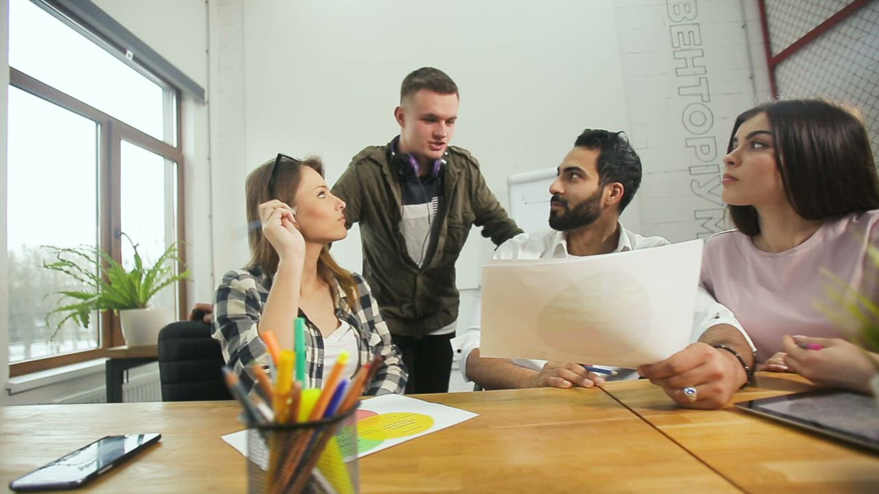 Design team review prototype in modern minimalist office - Free Stock Video