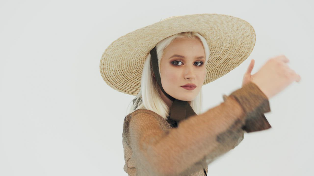 Studio shot of fashion model posing on white background - Free Stock Video