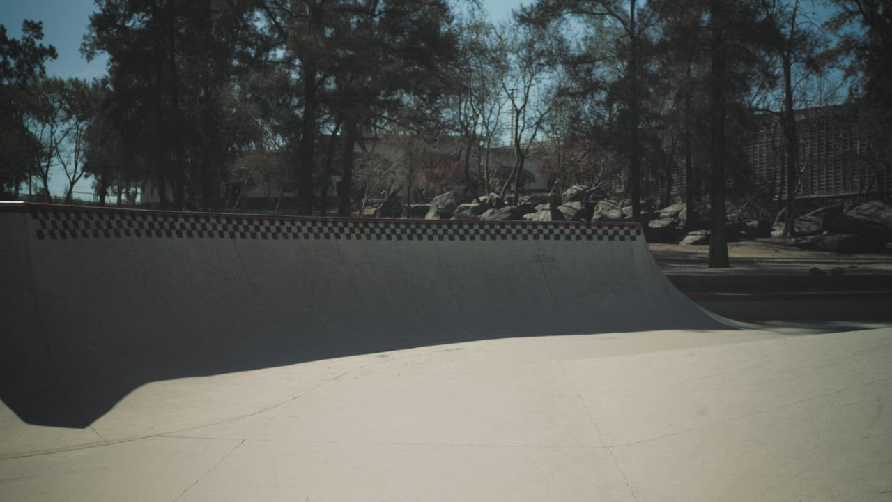 A skater doing skateboarding on a vert ramp - Free Stock Video