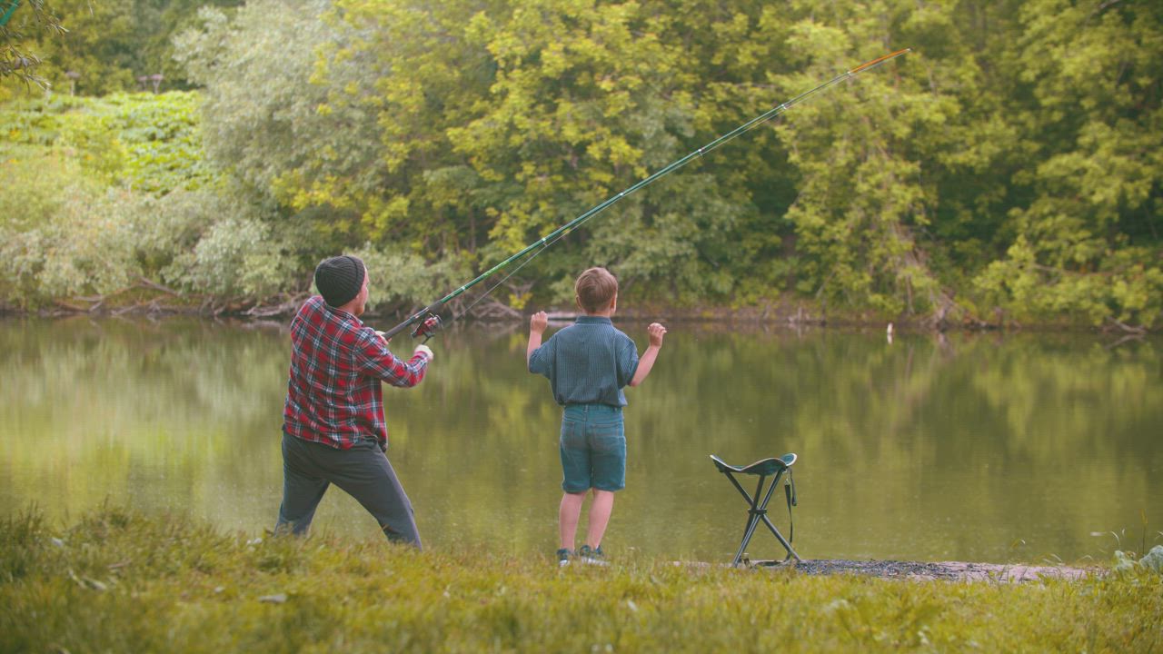 Brothers fishing in the lake - Free Stock Video