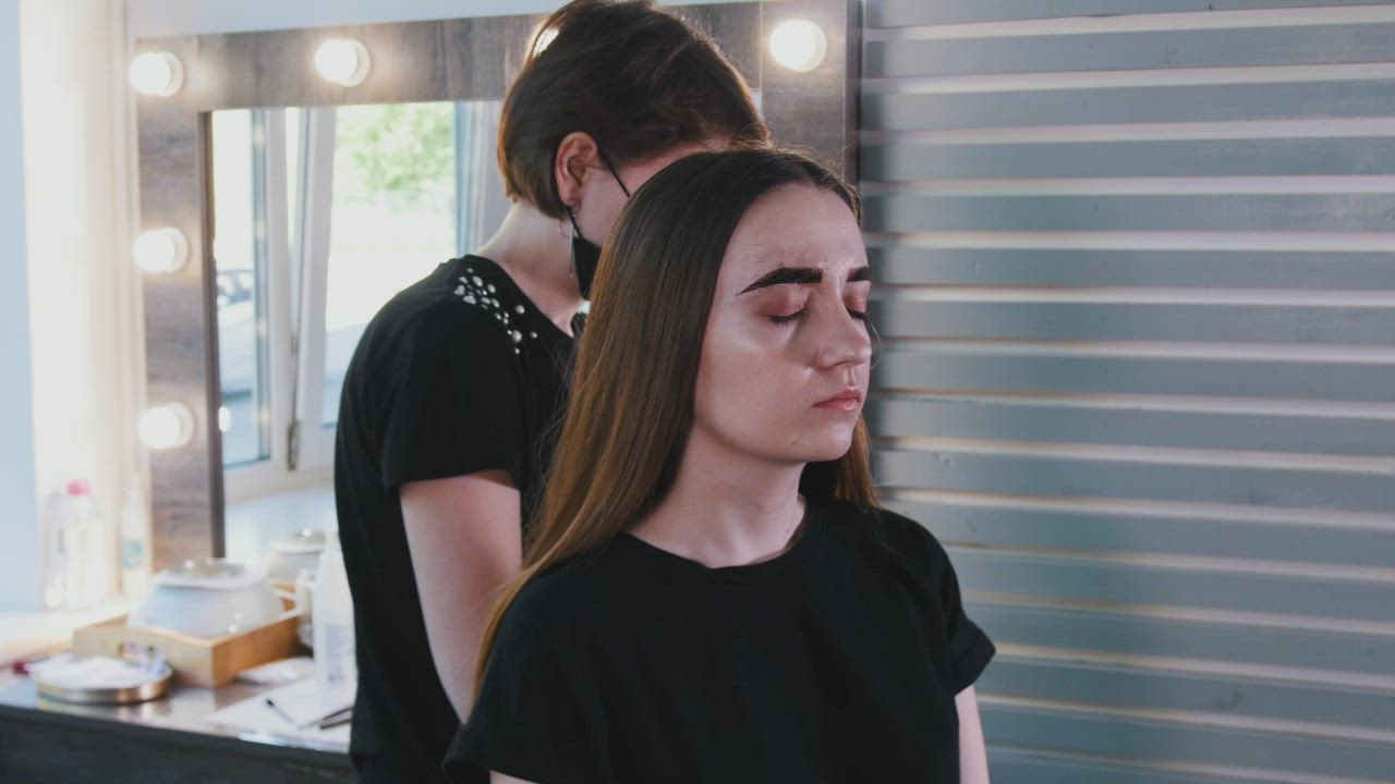 Makeup artist with medical mask working on a woman's eyebrows - Free ...