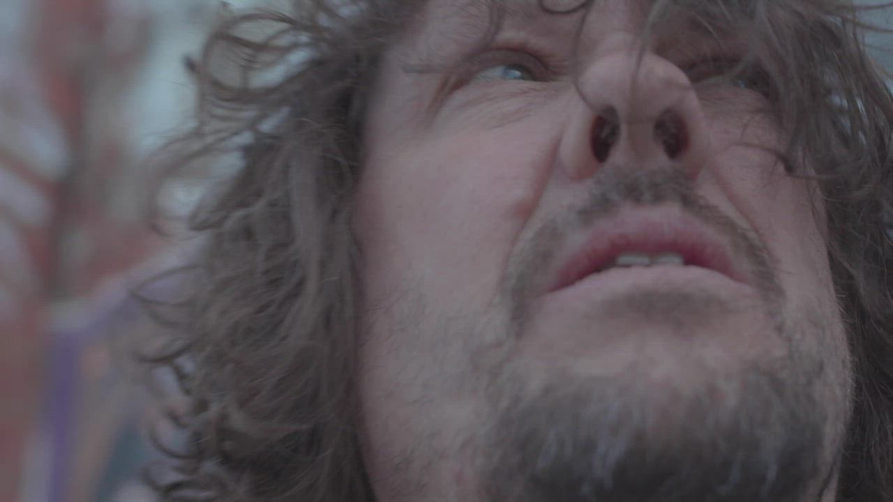 Punk man shakes his head in the street, closeup - Free Stock Video