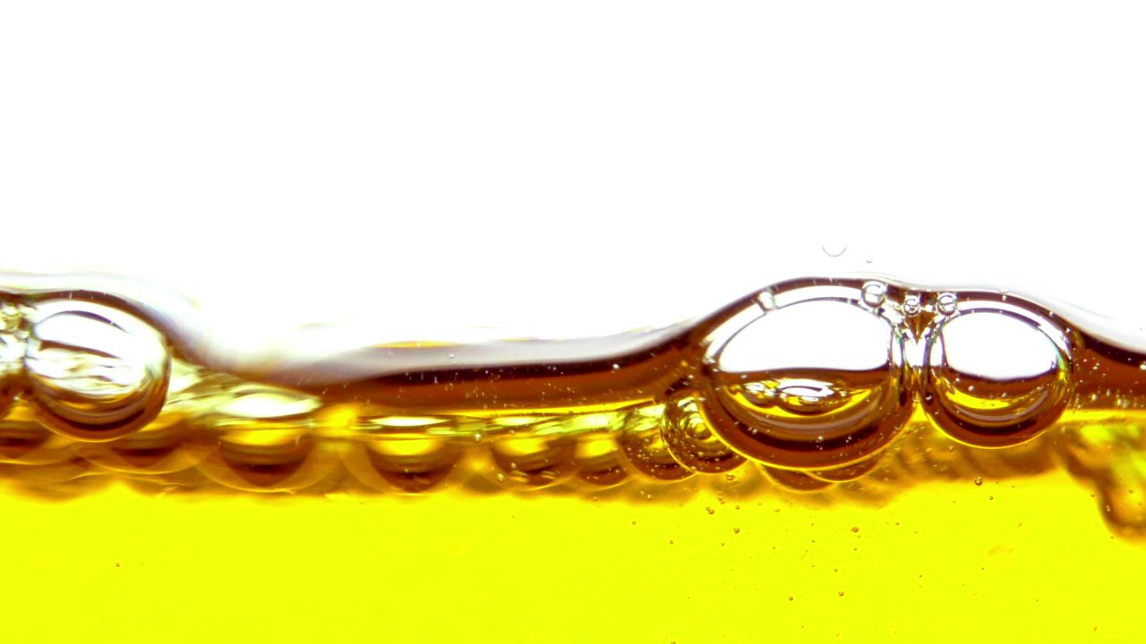 Air bubbles in oil in detail - Free Stock Video