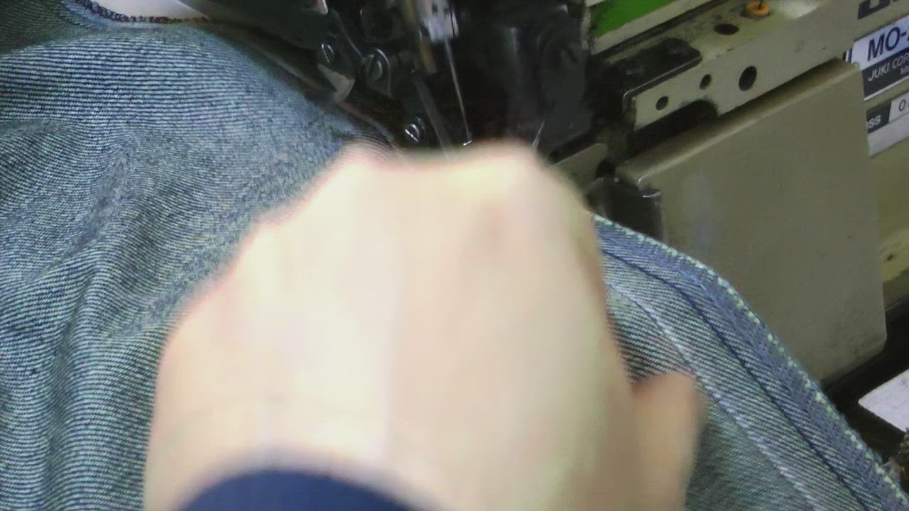 Sewing pants in industrial machine - Free Stock Video