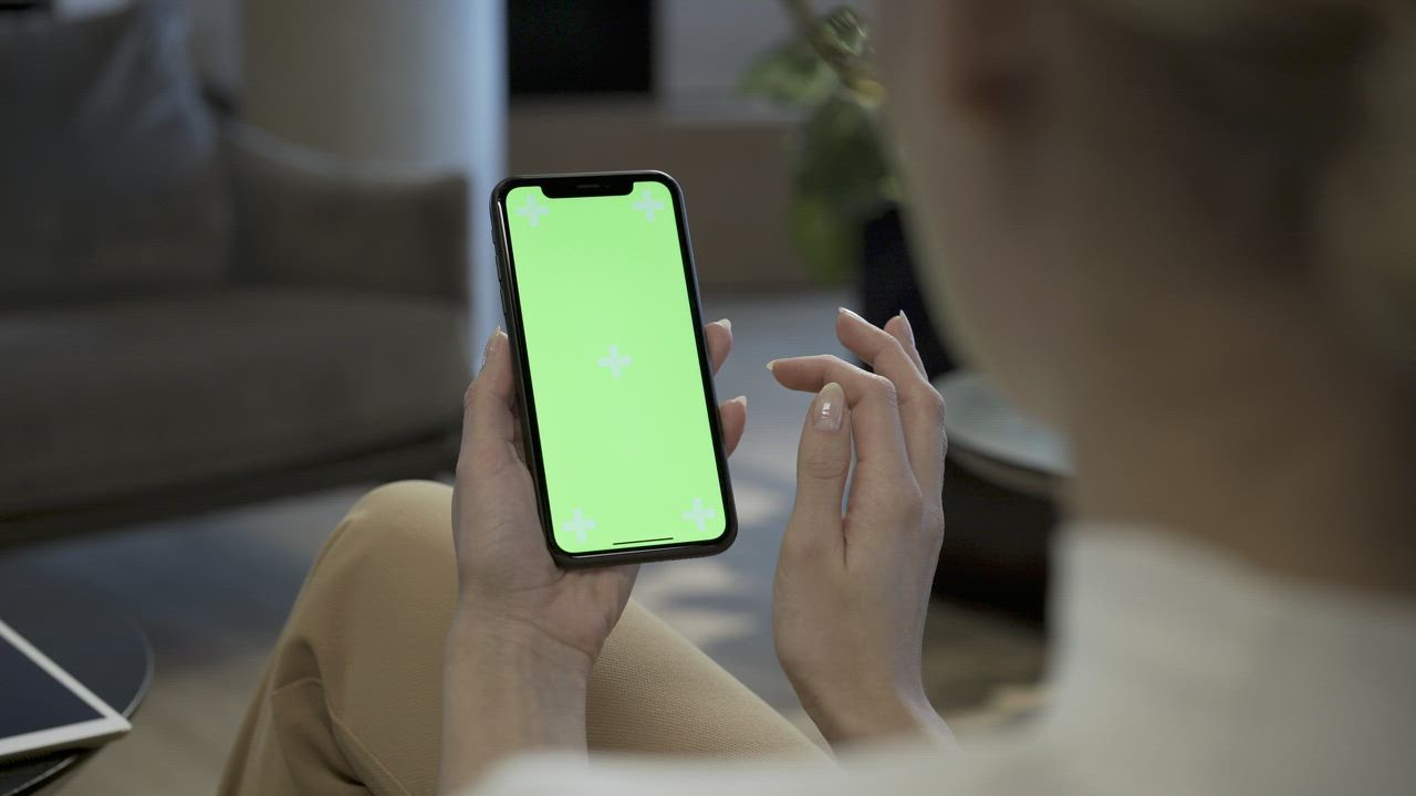 Woman swiping fingers on a mobile phone - Free Stock Video