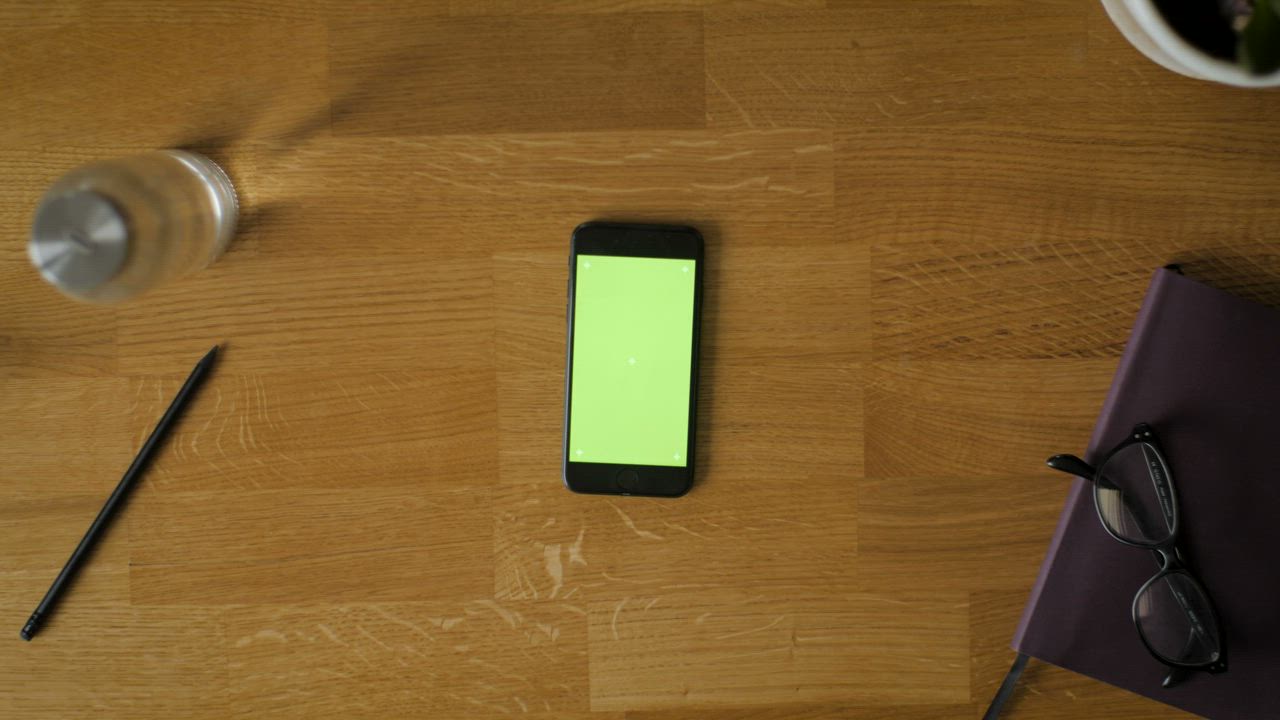 Hands using mobile phone on the desk - Free Stock Video
