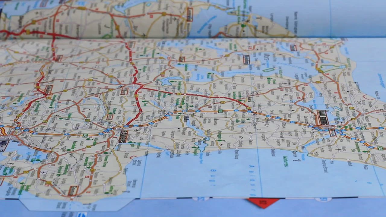 Exploring maps with hand - Free Stock Video