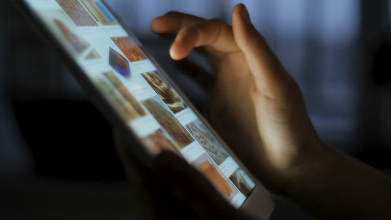 Browsing the web in a tablet device - Free Stock Video