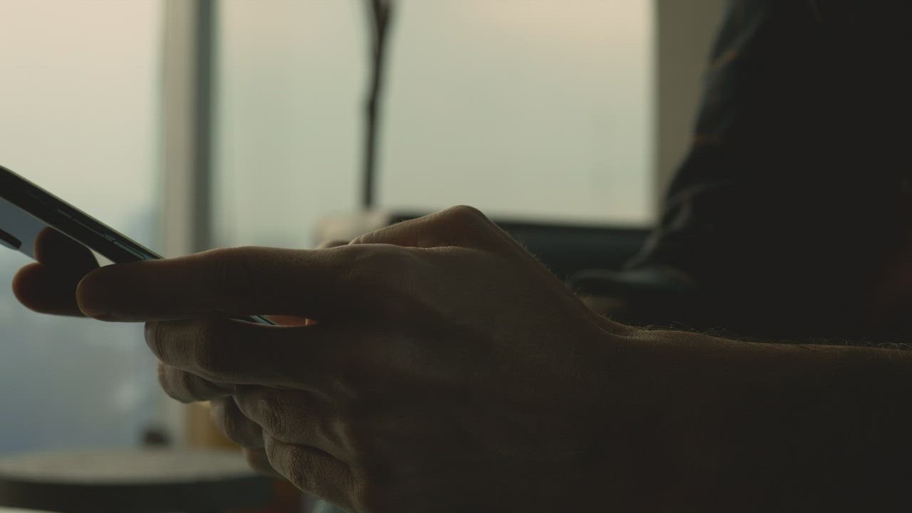 Hands shown texting on a smartphone - Free Stock Video
