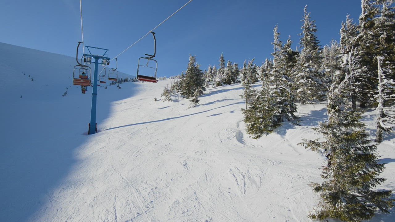 Climbing the mountain on the ski resort - Free Stock Video