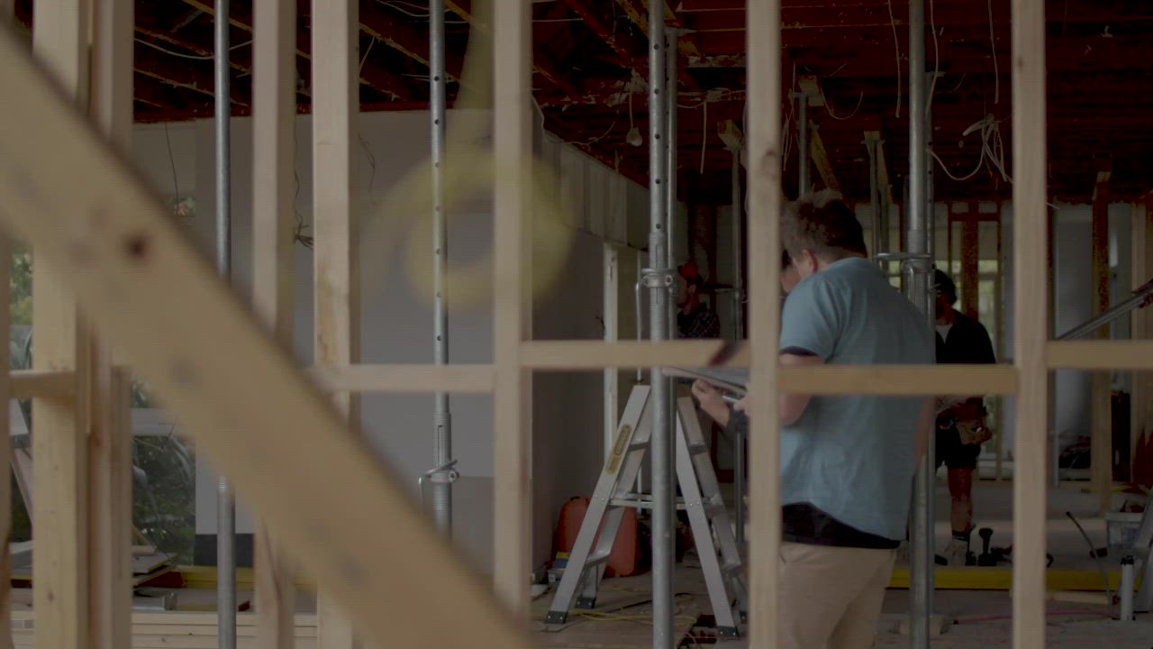 Construction workers at a house under construction - Free Stock Video