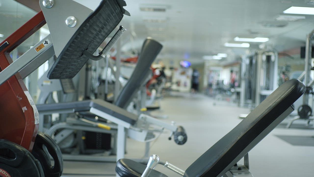 An athlete using the leg press at the gym - Free Stock Video