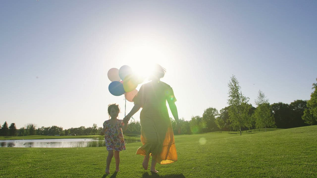 Running with balloons - Free Stock Video