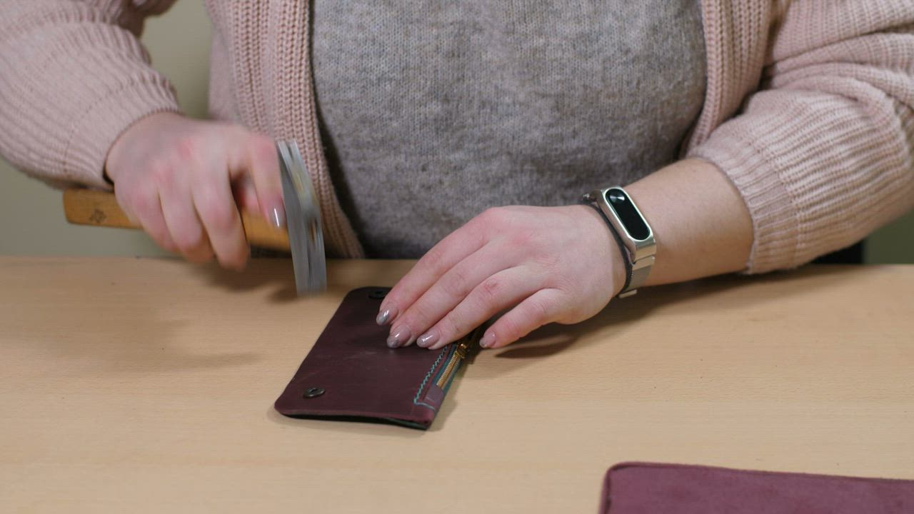 Woman repairing a wallet - Free Stock Video