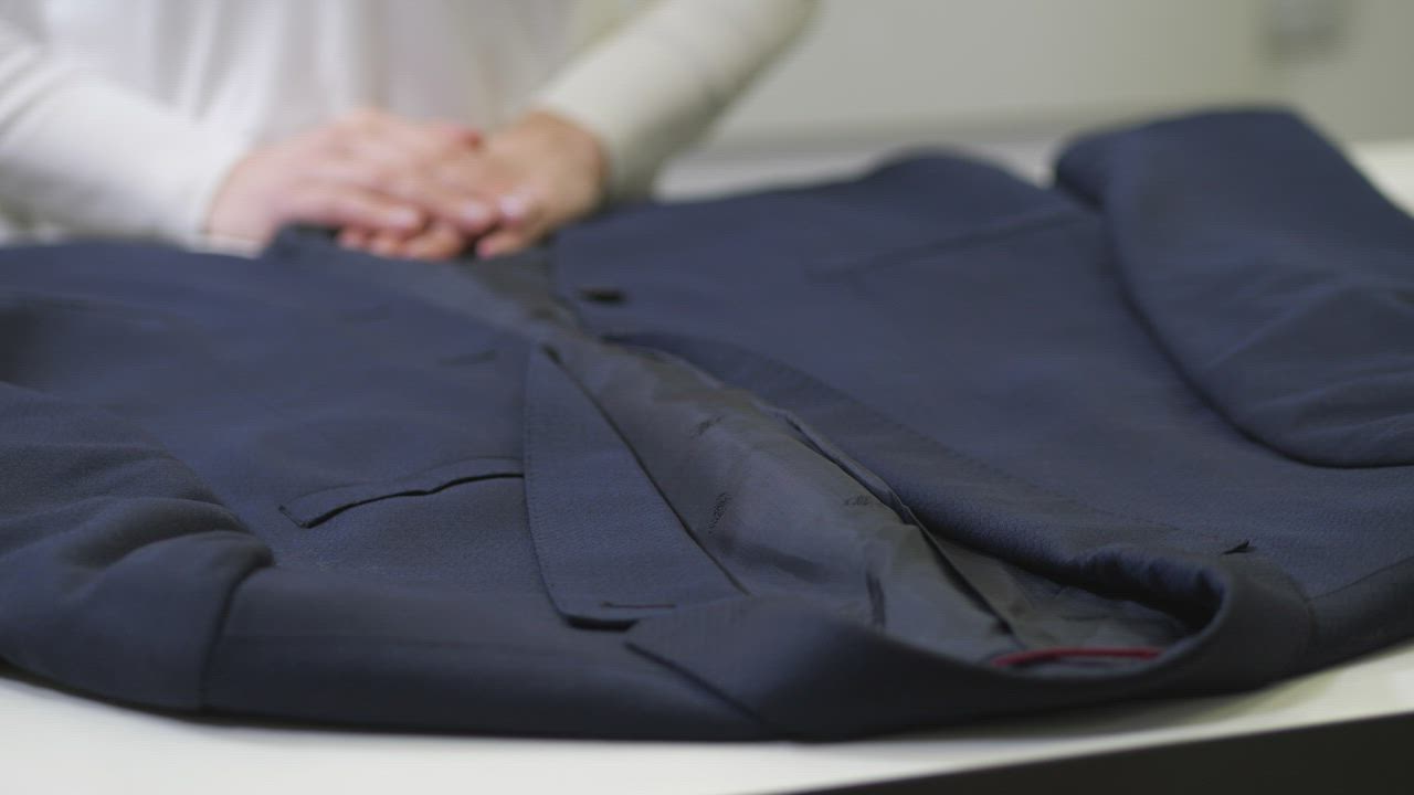 Preparing a jacket for cleaning - Free Stock Video