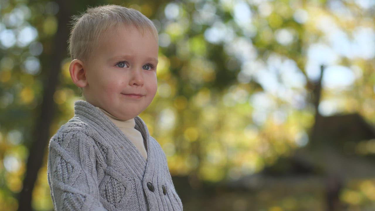 Shy boy looking at someone - Free Stock Video