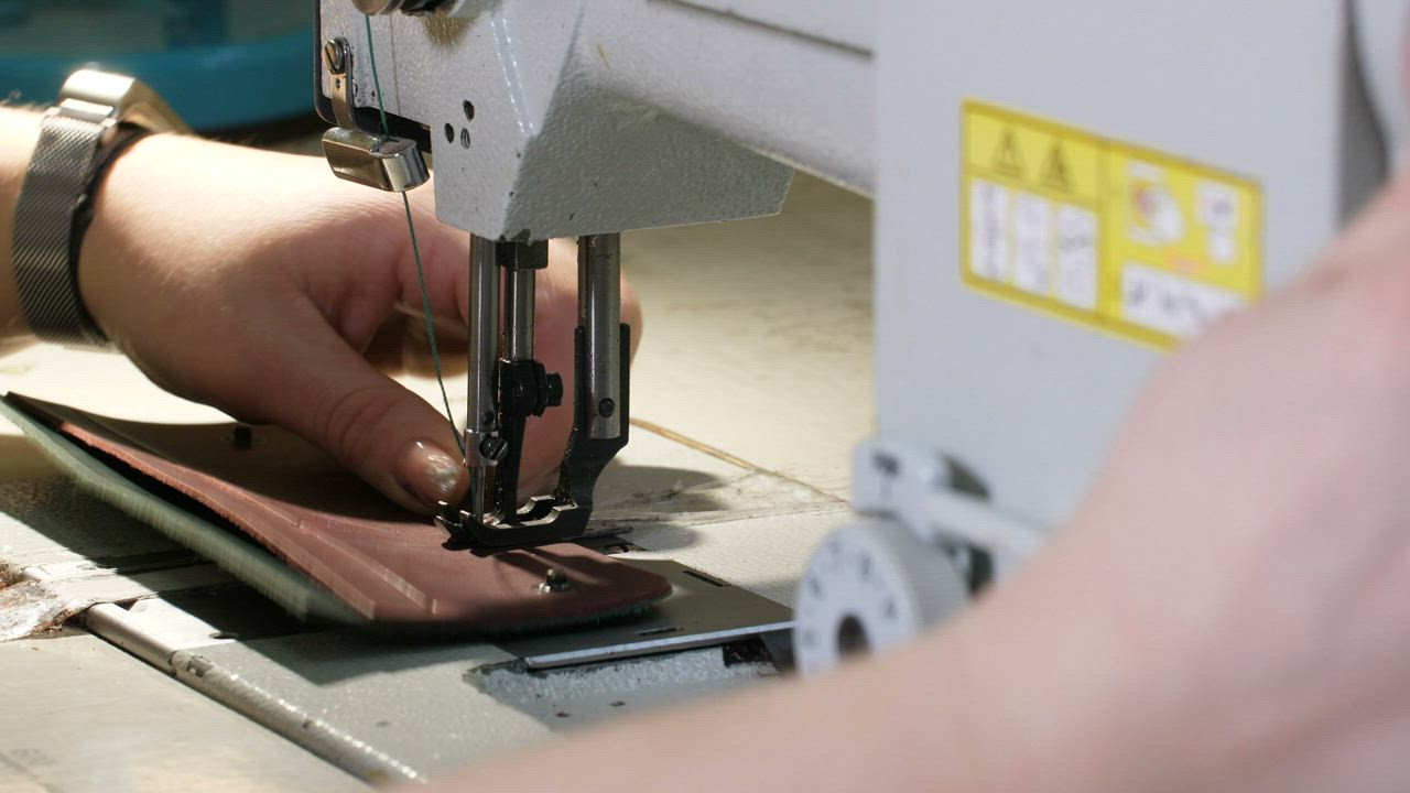 Woman using a sewing machine at home - Free Stock Video