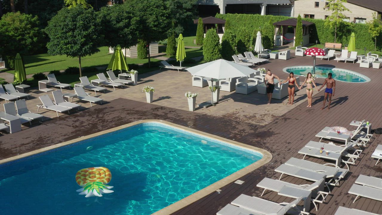 Group of friends jumping into a pool - Free Stock Video