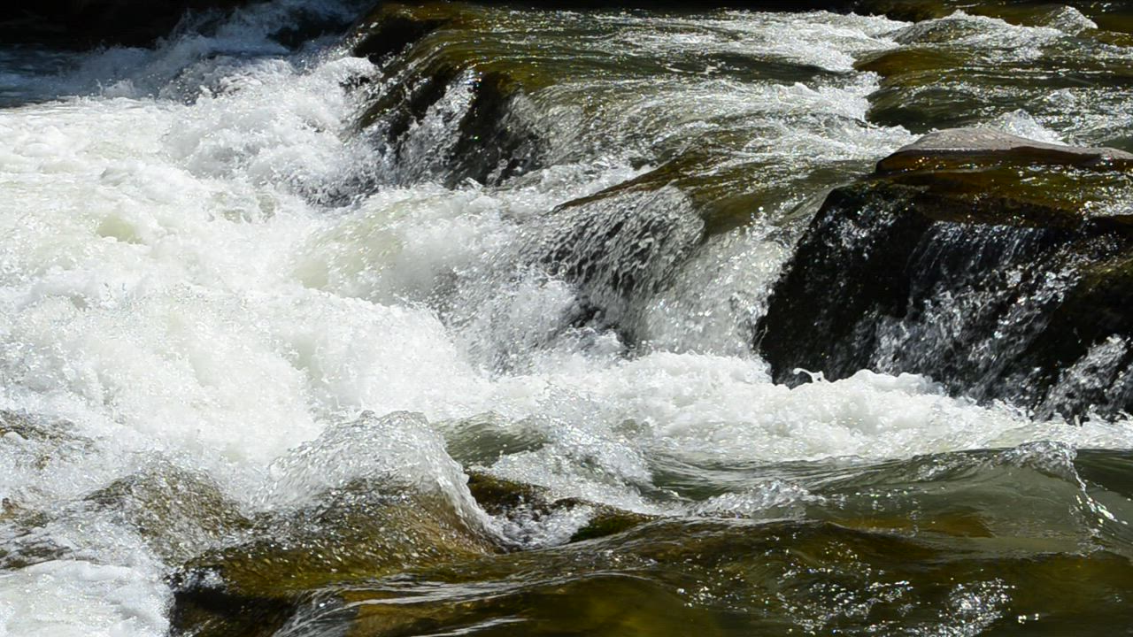 White water breaking over rocks - Free Stock Video