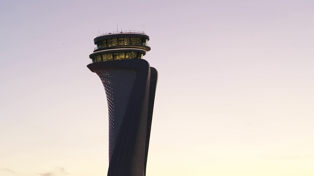 Modern airport tower against the sunset - Free Stock Video