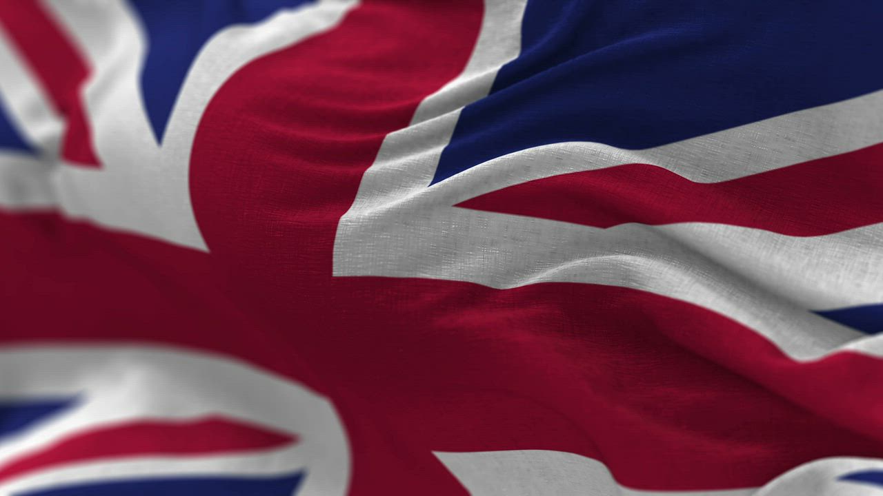 Closeup of United Kingdom flag waving in wind - Free Stock Video