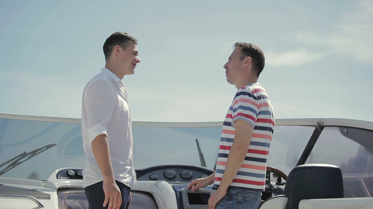 Men handshake over deal on deck of yacht - Free Stock Video