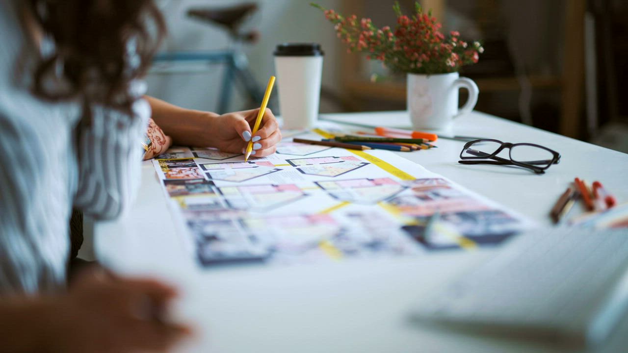 Two creative women drawing plan on desk in modern studio - Free Stock Video