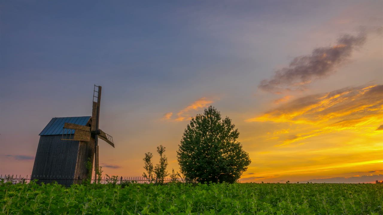 Wooden windmill at a beautiful sunset - Free Stock Video