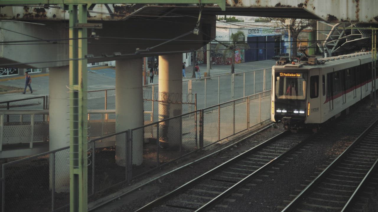 City train driving under a bridge - Free Stock Video