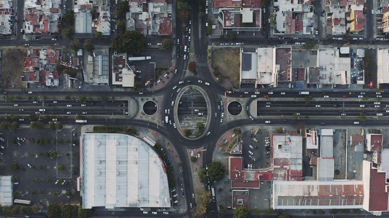 Roundabout city traffic, aerial shot - Free Stock Video
