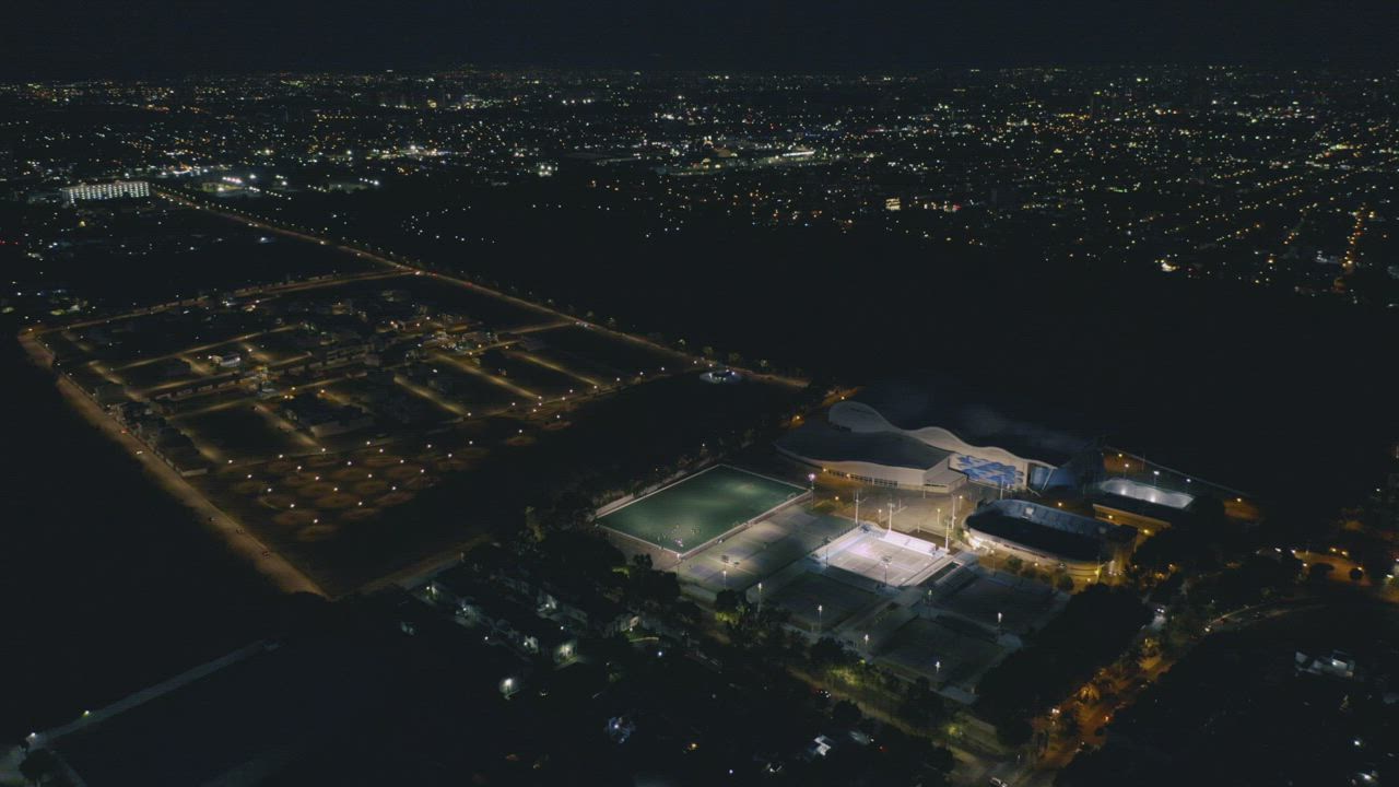 Aerial view of a sports center at night time - Free Stock Video