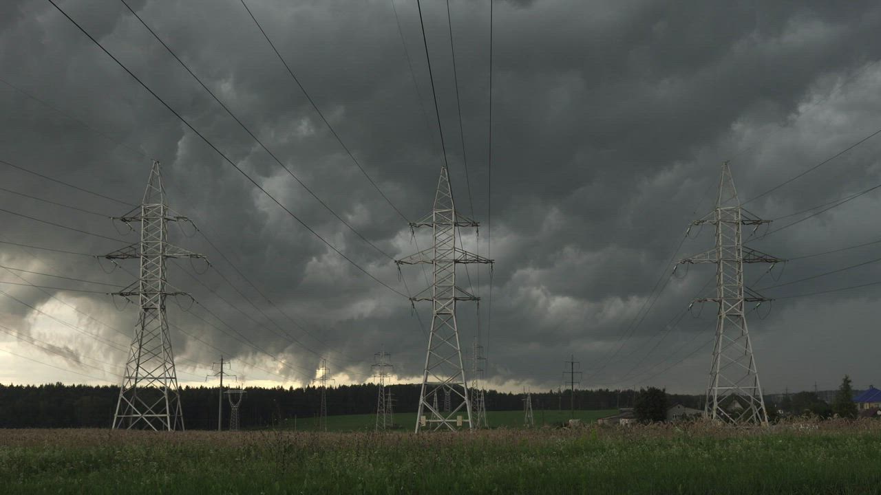 Storm clouds moving over power lines - Free Stock Video