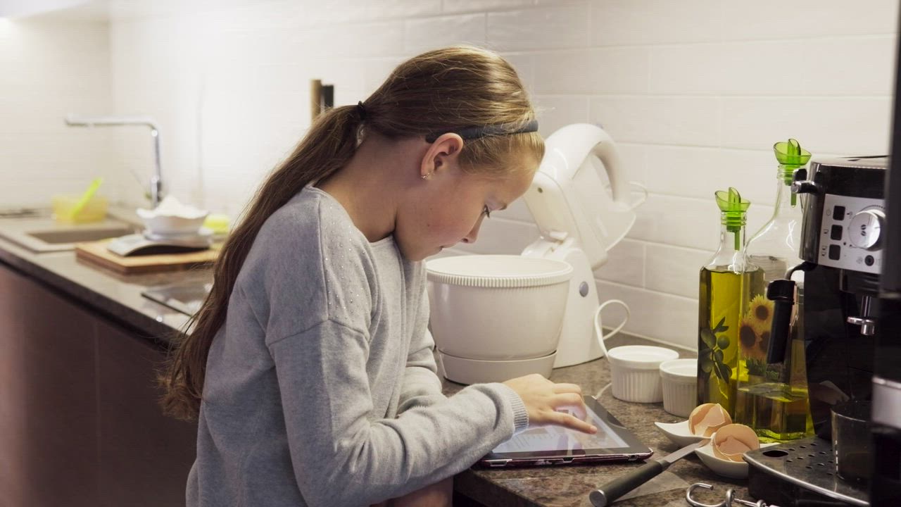 Following along to a recipe - Free Stock Video