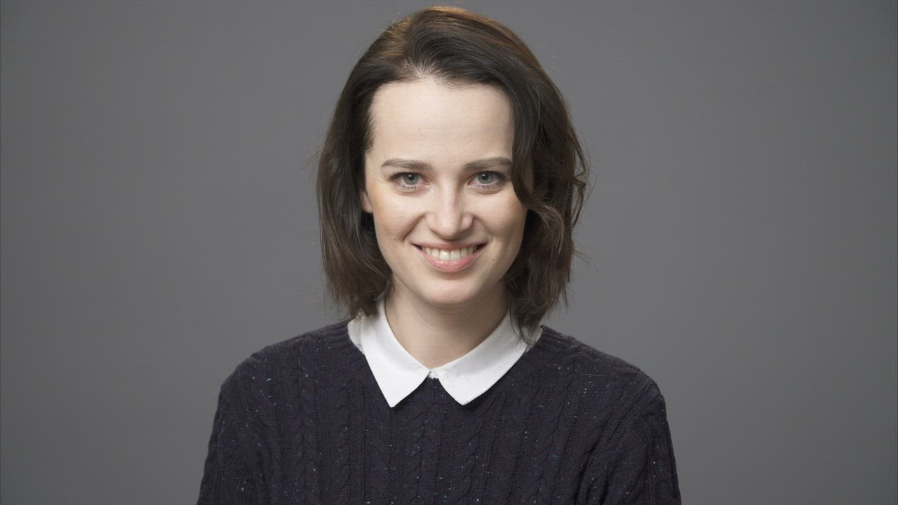 Woman smiling while laughing gently - Free Stock Video