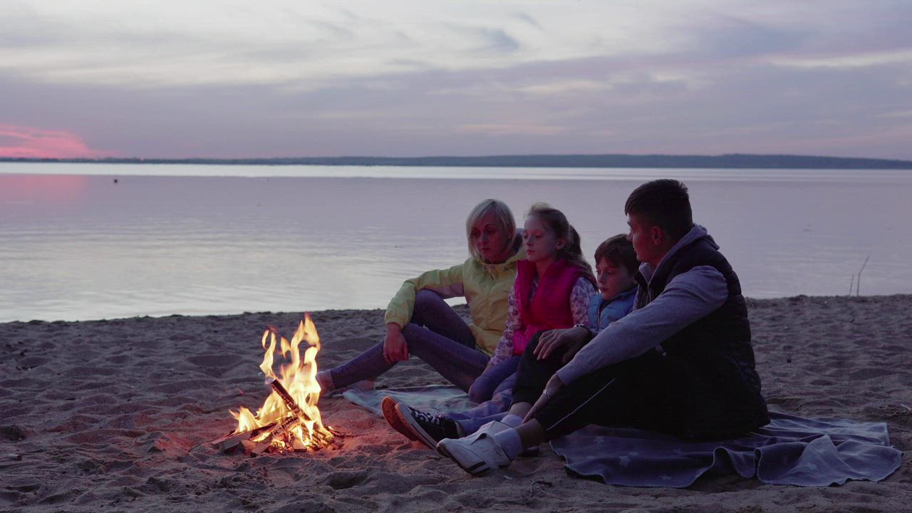 Keeping warm by the fire - Free Stock Video