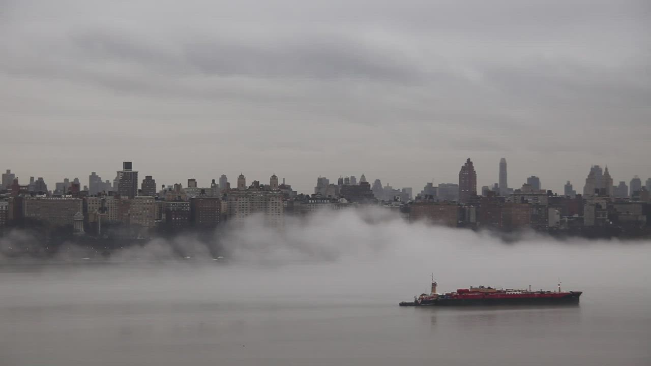 Fog sweeping across the ocean - Free Stock Video