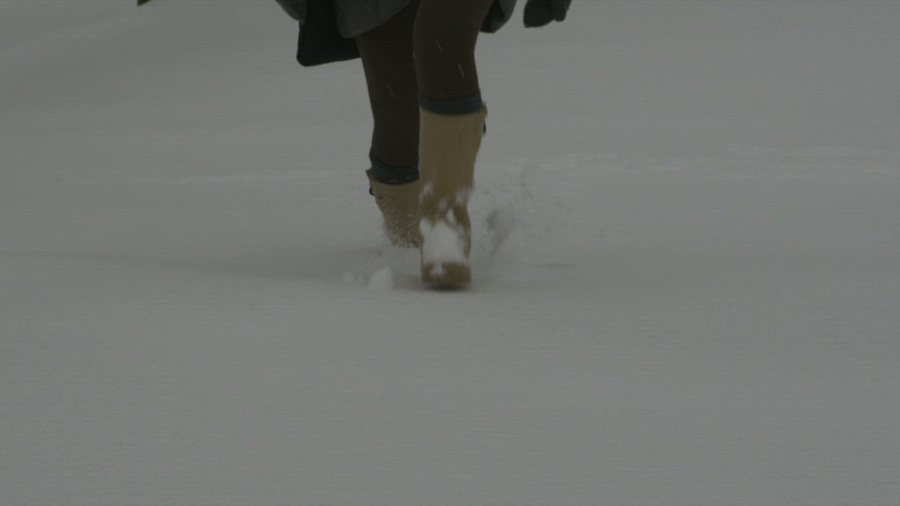 Walking across fresh snow - Free Stock Video