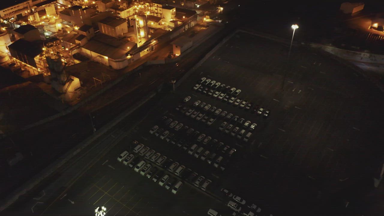 Night factory reveal, aerial view - Free Stock Video