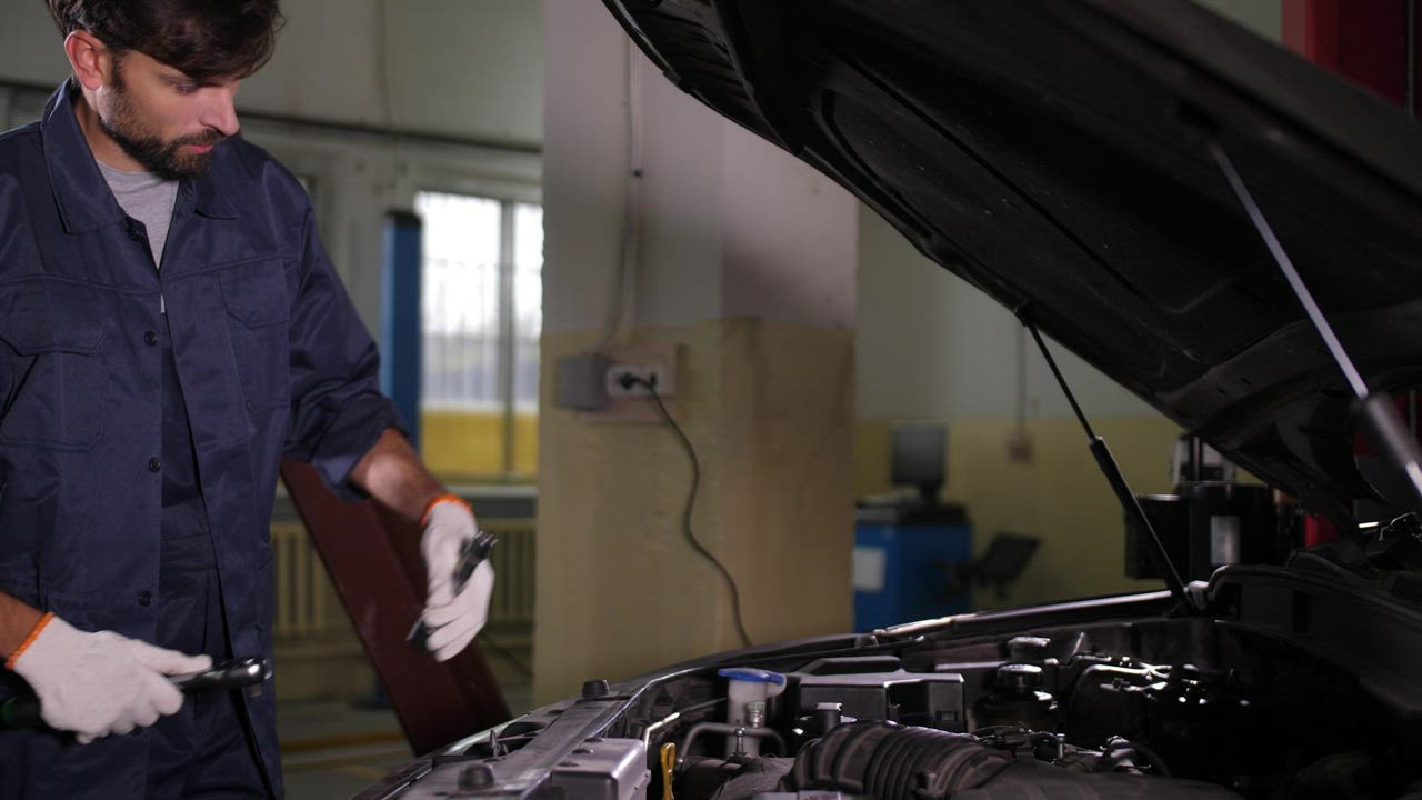 Replacing an oil filter - Free Stock Video