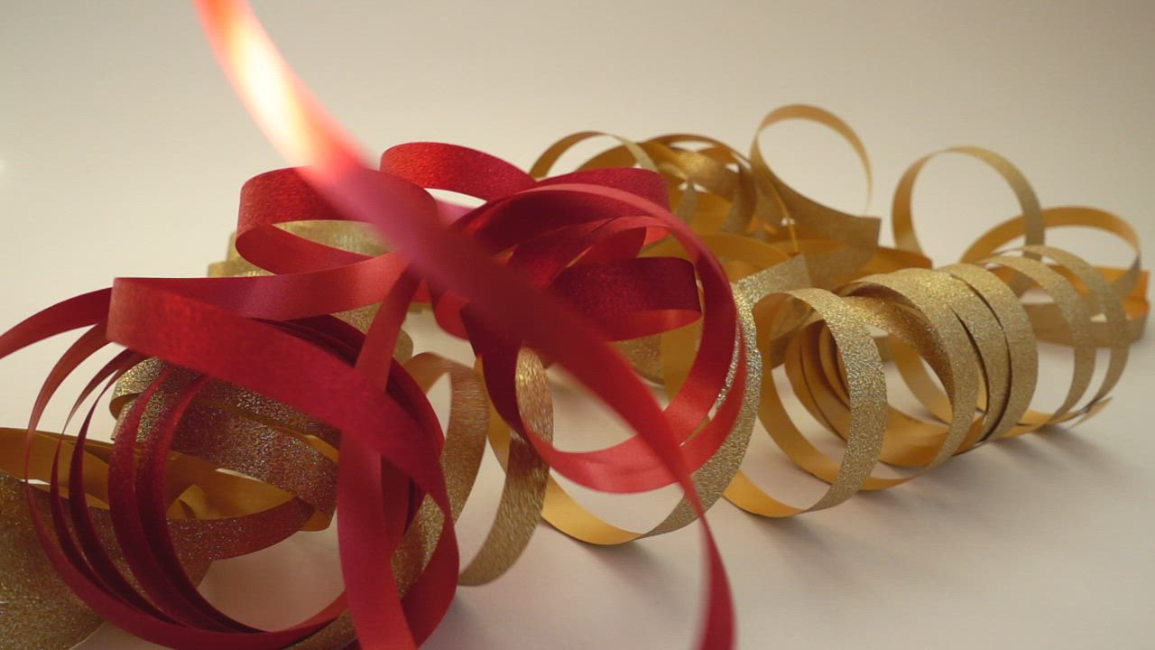 Ribbons falling on the ground - Free Stock Video