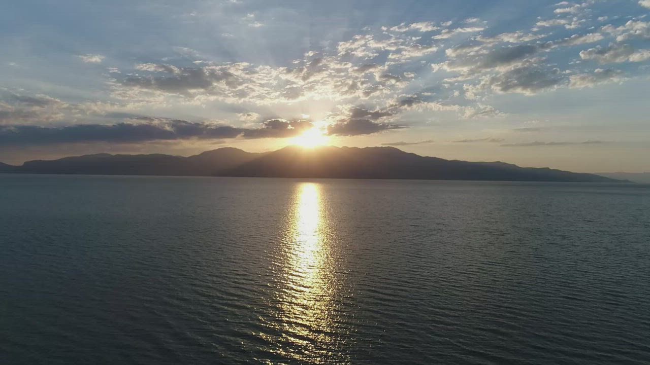 Sunlight reflecting across the sea - Free Stock Video