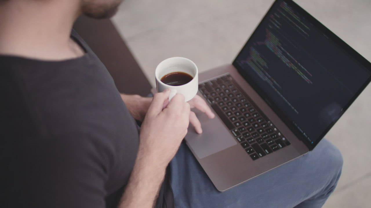 Software developer holding a coffee cup - Free Stock Video