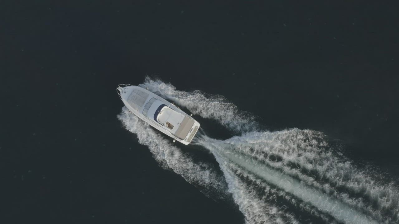Speedboat cutting across the ocean - Free Stock Video