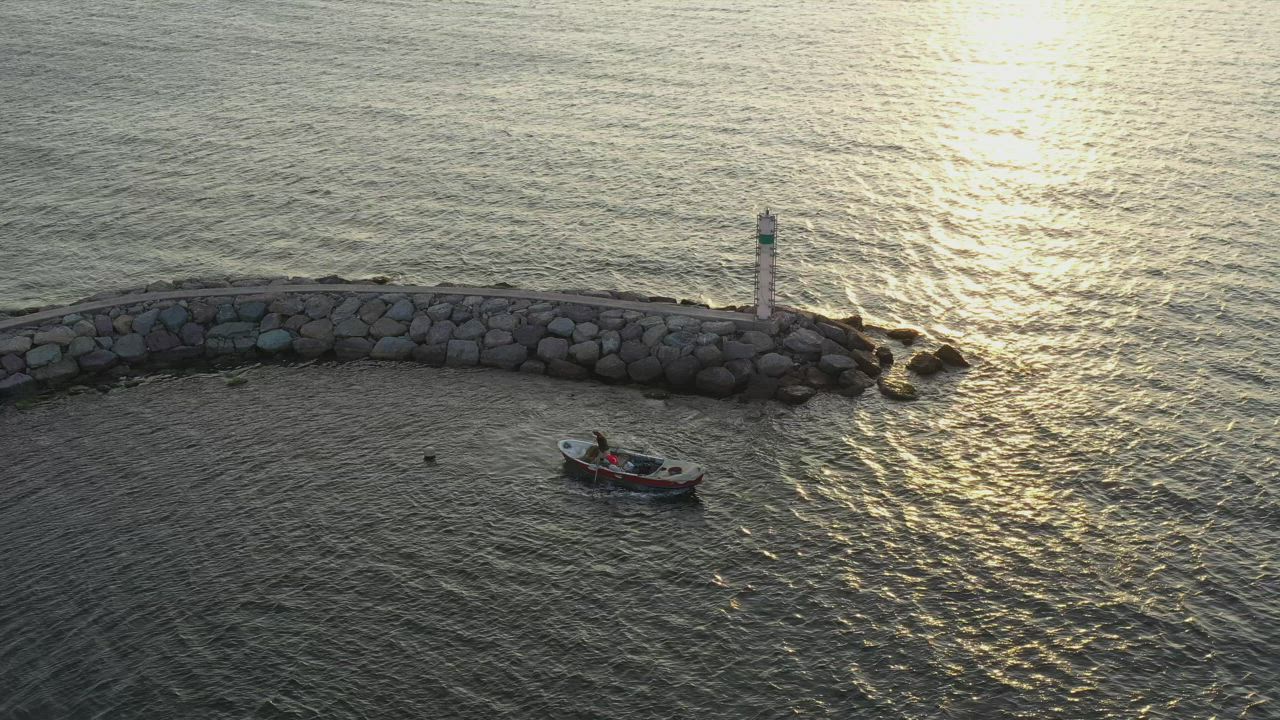 Small lighthouse on the rocks - Free Stock Video