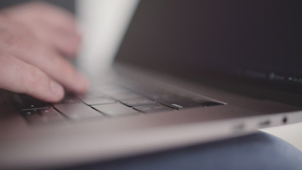Hands typing slowly on laptop - Free Stock Video